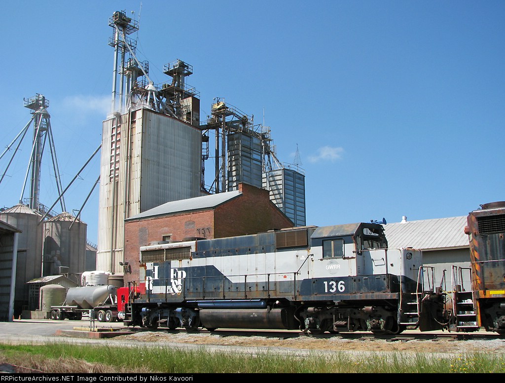 GWRR 136 sitting in front of the soon to be closed feed mill